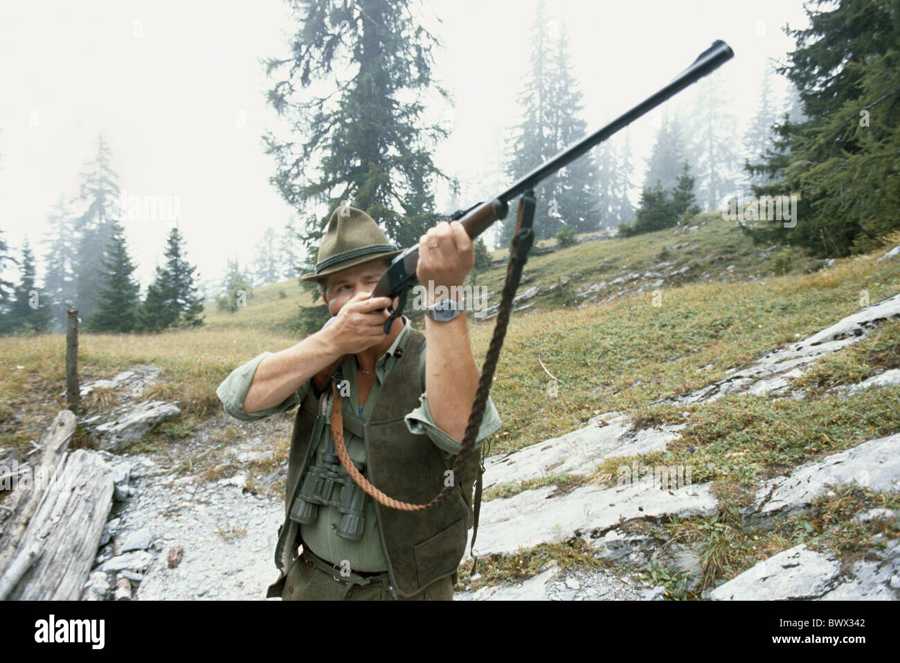 gun hunt hunter rifleman man portrait sport aim Stock Photo - Alamy
