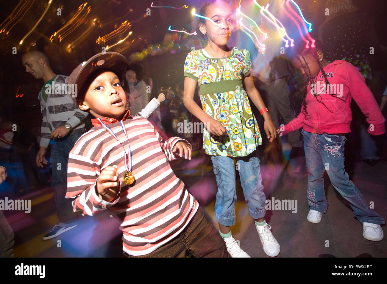 Girls and boys at Children's Disco in London Junior disco hip-hop ...
