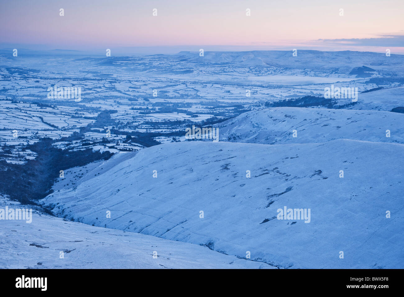 Dawn view of winter landscape from Summit of Pen Y Fan, Brecon Beacons ...