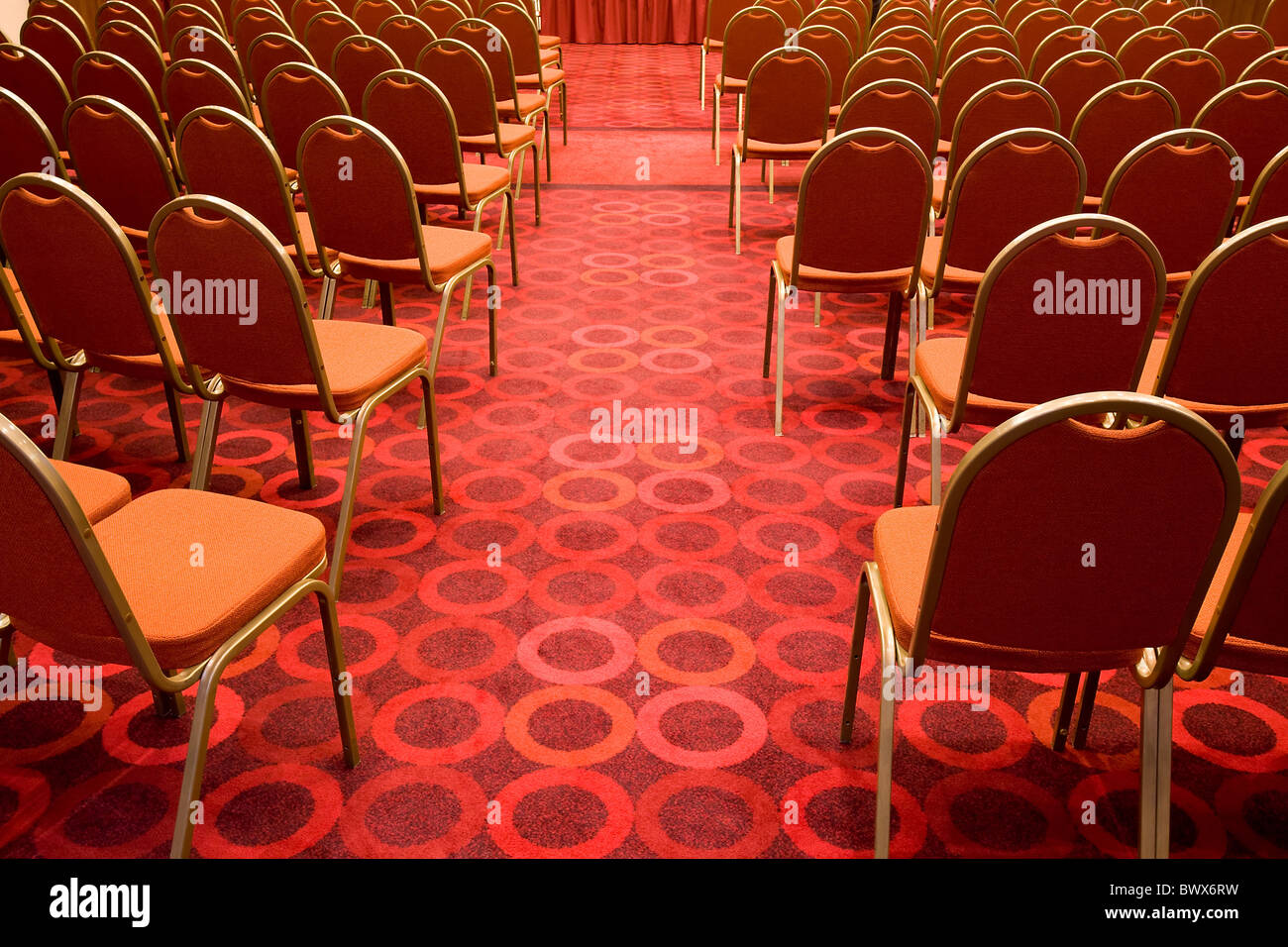 Back view of several rows of red armchairs in conference hall Stock ...