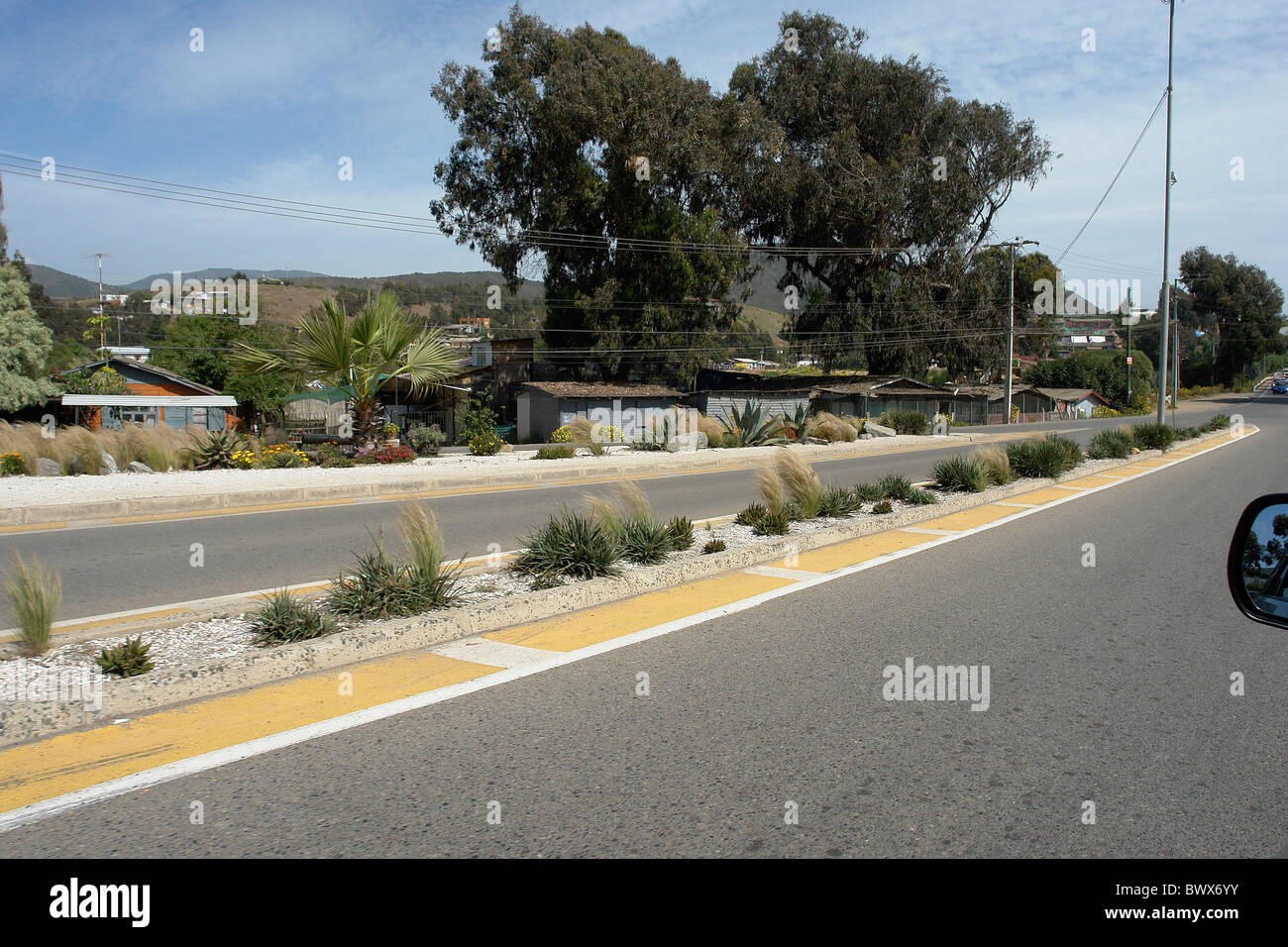 Yellow separation of rural road Stock Photo - Alamy