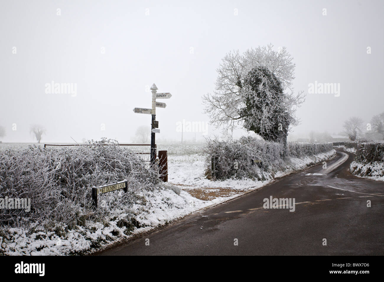 Road sign in snow Stock Photo - Alamy