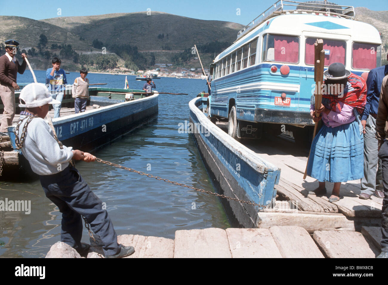 BOLIVIA. NATIVE AYMARA PEOPLE GETTING OFF BOAT ON LAKE TITICACA Stock ...