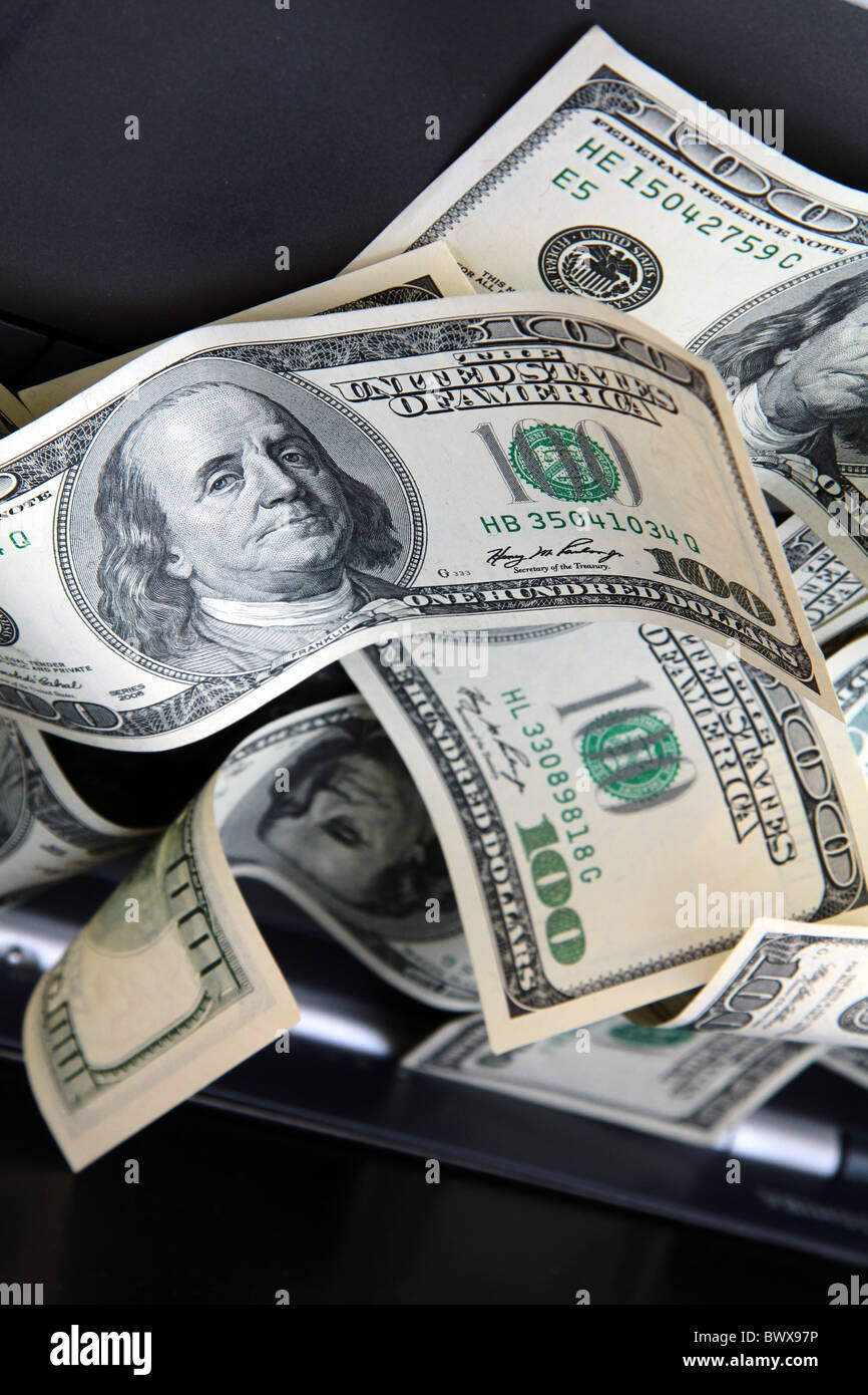 Lot of U.S. dollars on a black background Stock Photo - Alamy
