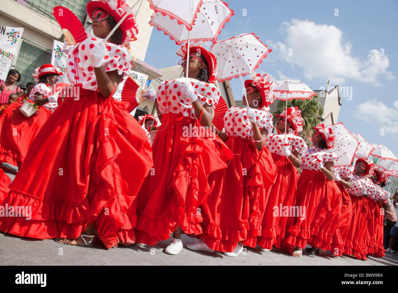 Junior traditional Mas parade, Dames Lorraines in red and white dancing ...