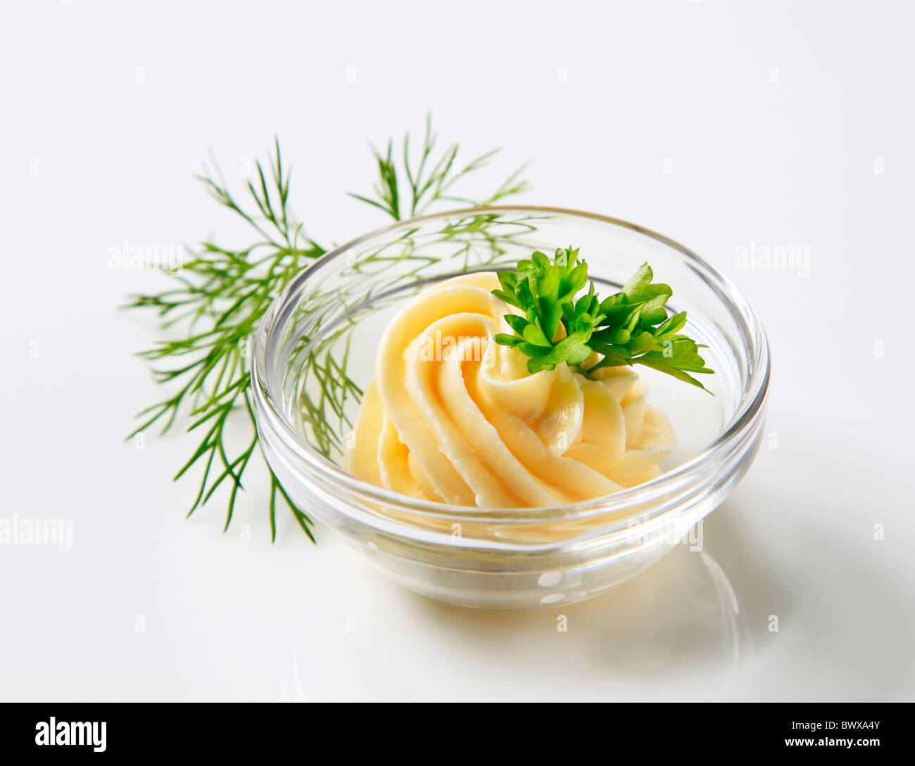 Swirl of fresh butter in a glass dish Stock Photo - Alamy