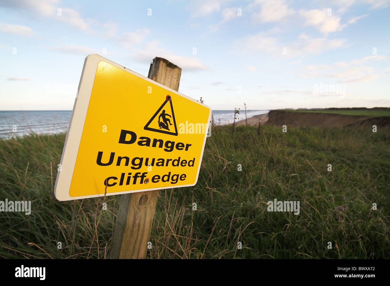Cliff erosion danger signs over clay cliff at Skipsea in North ...