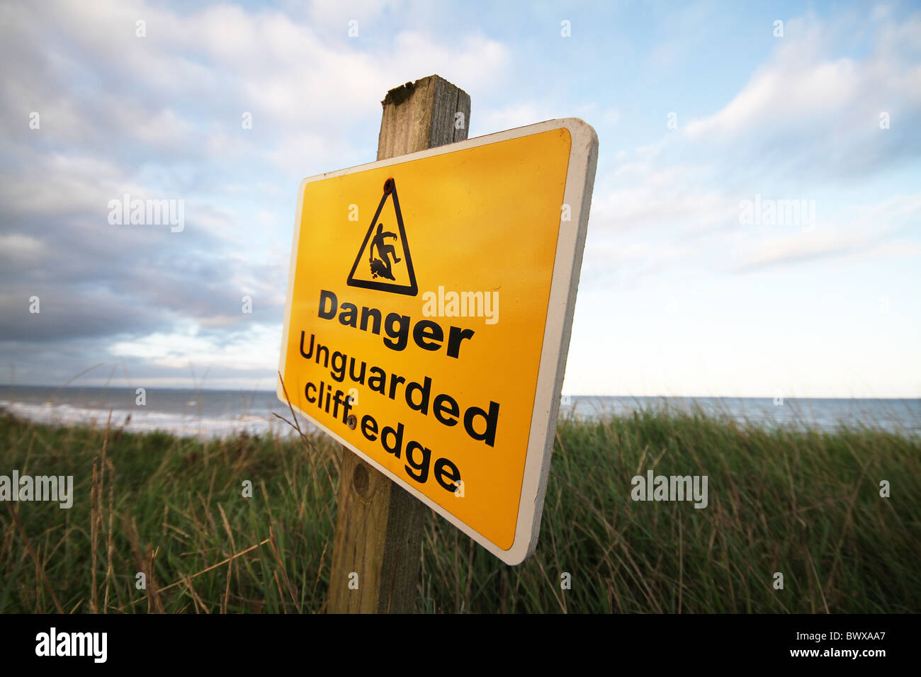 Cliff erosion danger signs over clay cliff at Skipsea in North ...