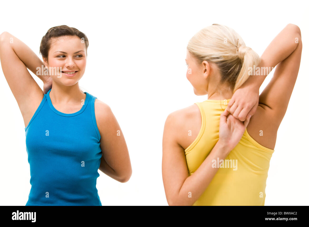 Photo of two pretty friends having a chat during workout in gym Stock ...