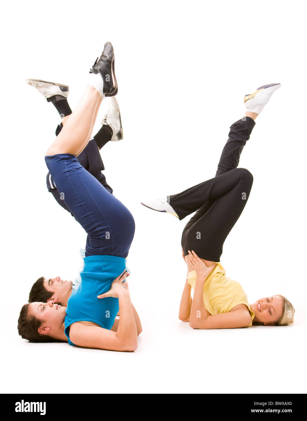 Photo of young adults doing physical exercise over white background ...