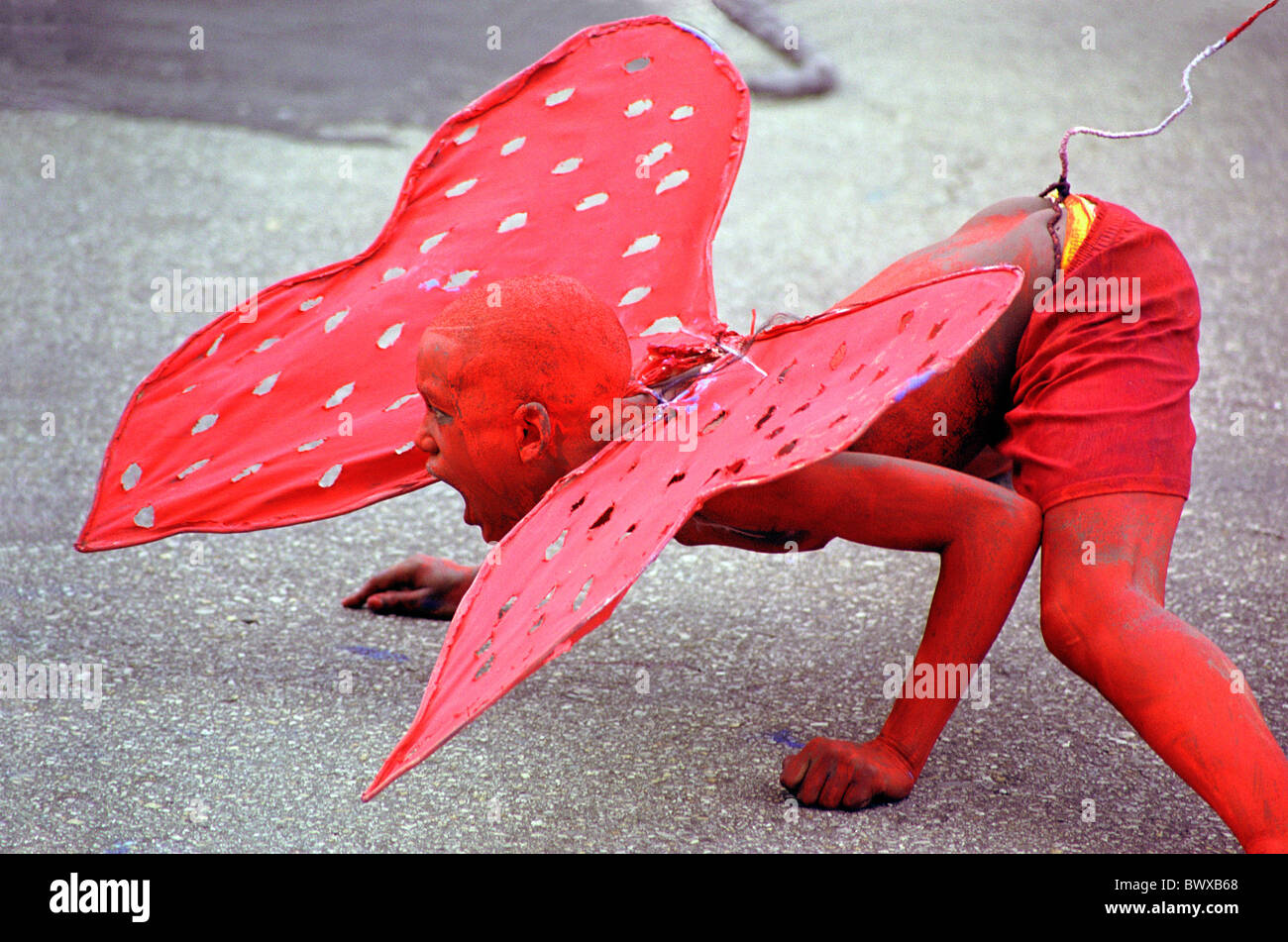 Trinidad Carnival - traditional mas boy playing red devil jab molassie ...
