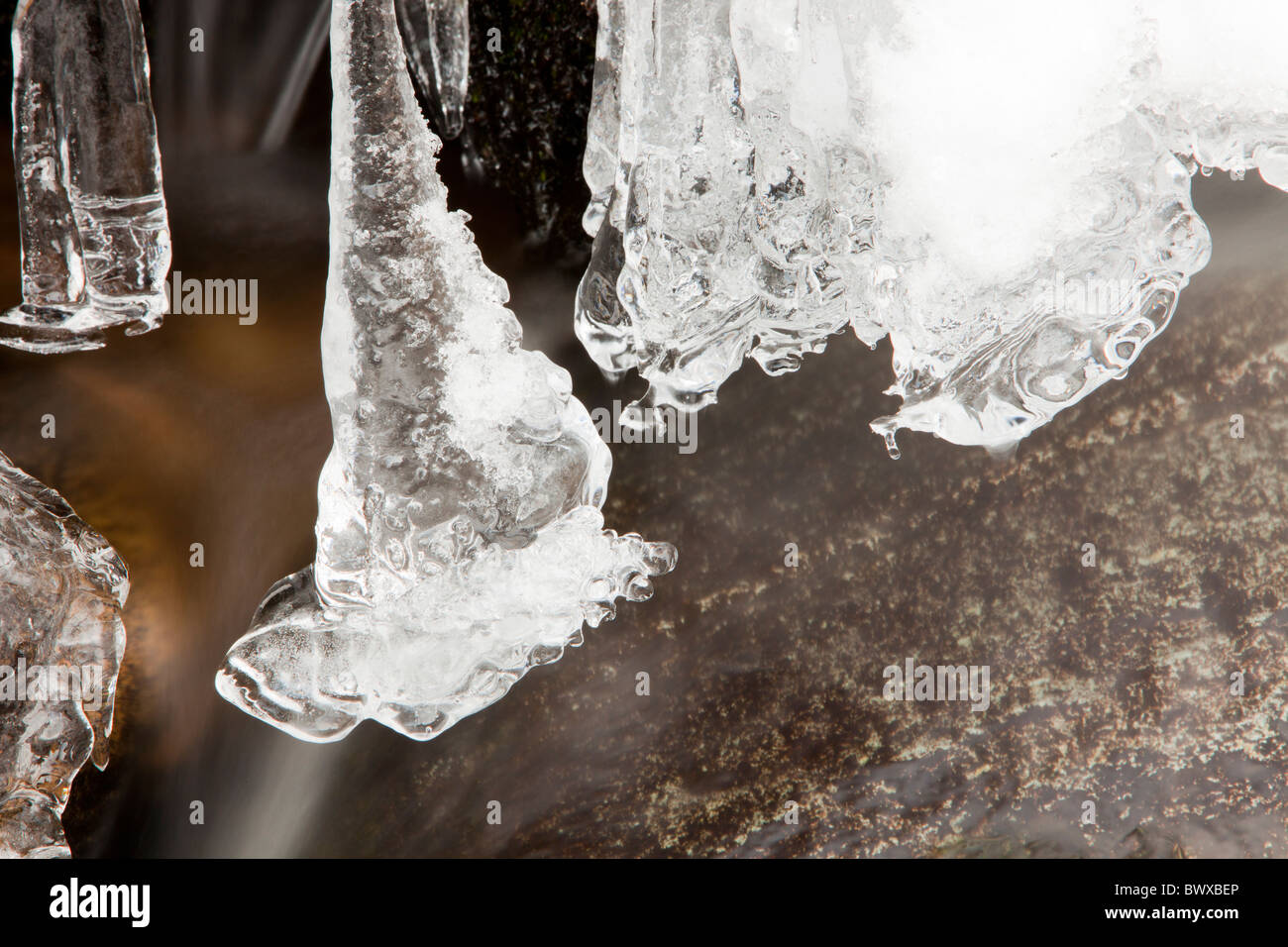A mountain stream freezing up in winter, Ambleside, Lake District, UK ...