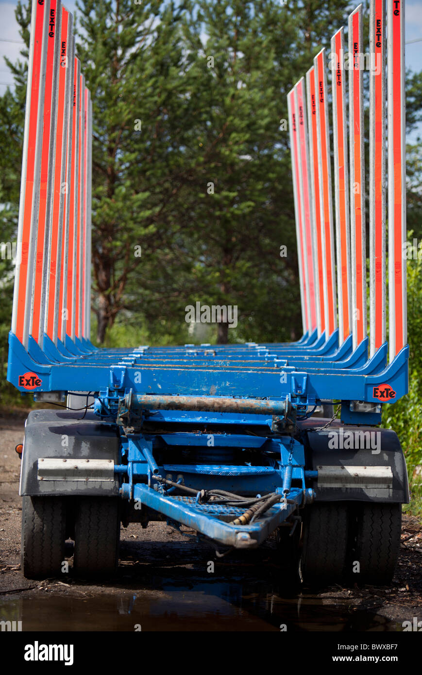 Empty Finnish log transport truck trailer with reflective side stakes ...