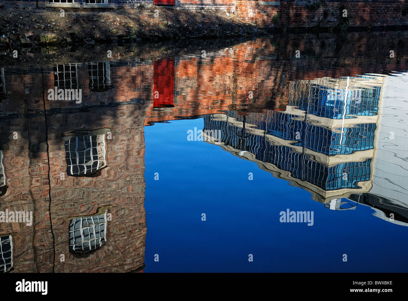 city buildings reflection into canal Nottingham uk Stock Photo - Alamy