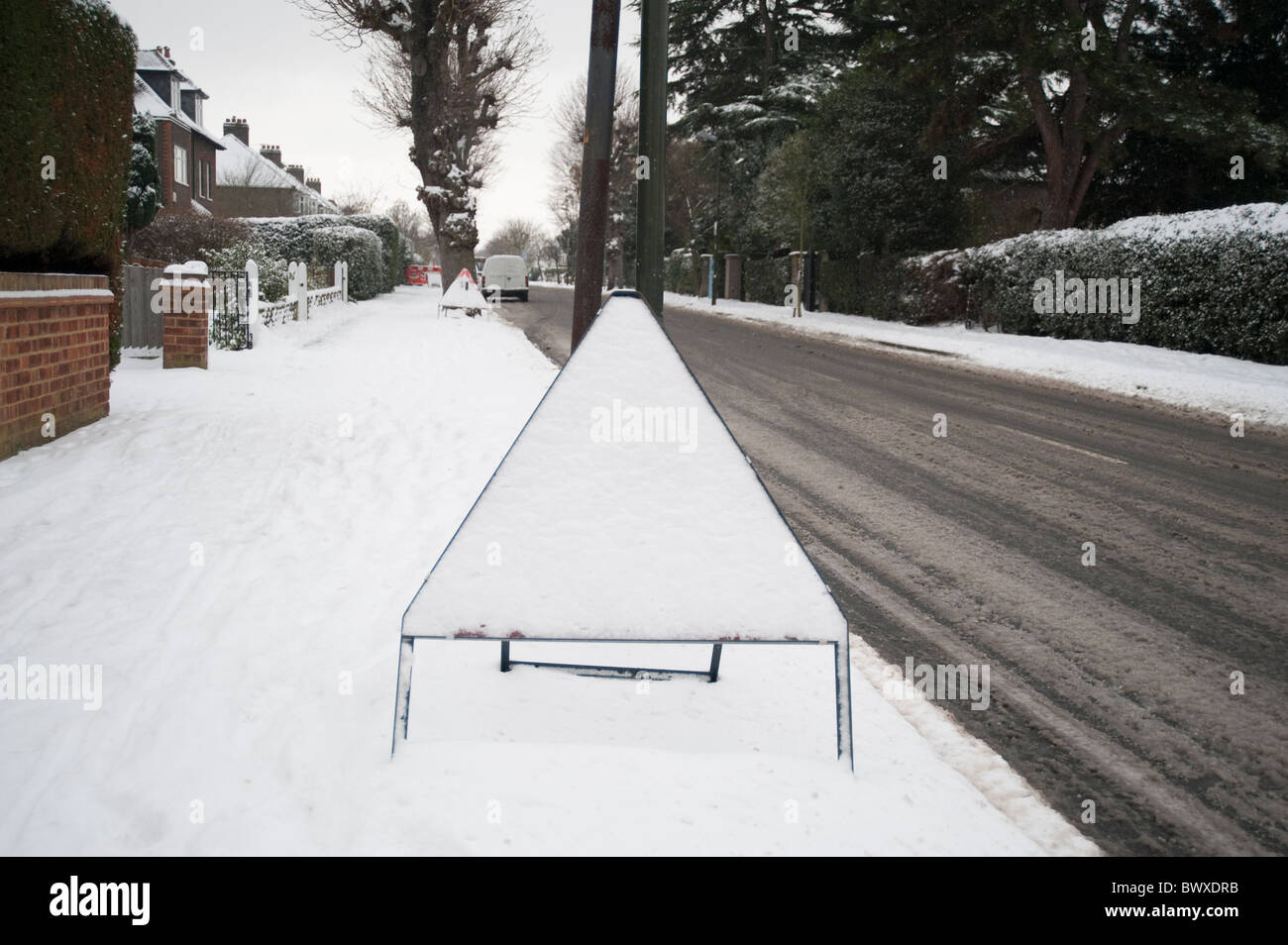 Snow Covered Triangle Warning Sign Stock Photo - Alamy
