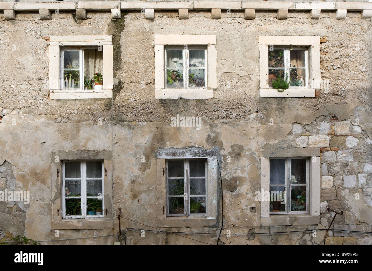 Six windows in the side of a building in Dubrovnik Old Town Stock Photo ...