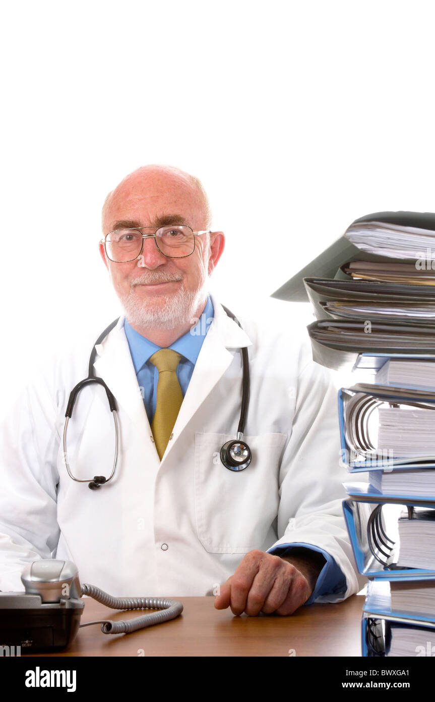 Senior doctor at his desk Stock Photo - Alamy