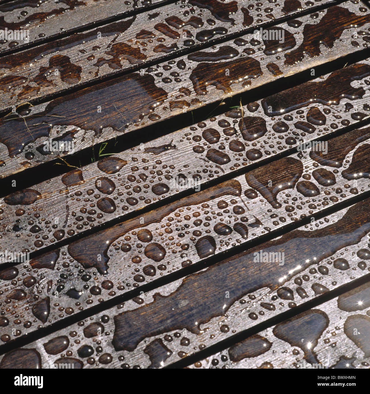 wooden boards small little puddles rains Stock Photo - Alamy