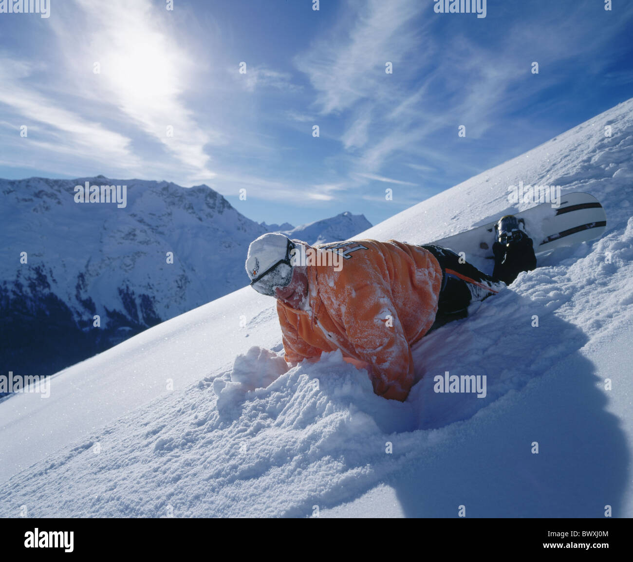 slope mountain overthrown man snowboard sun Saint Moritz deep snow fall ...