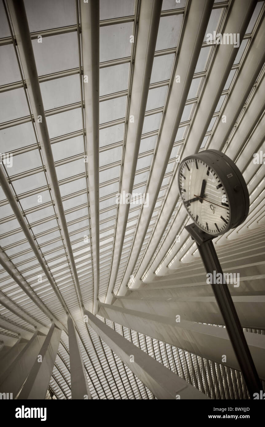 Clock in Liège Guillemins Calatrava train station against glass roof ...