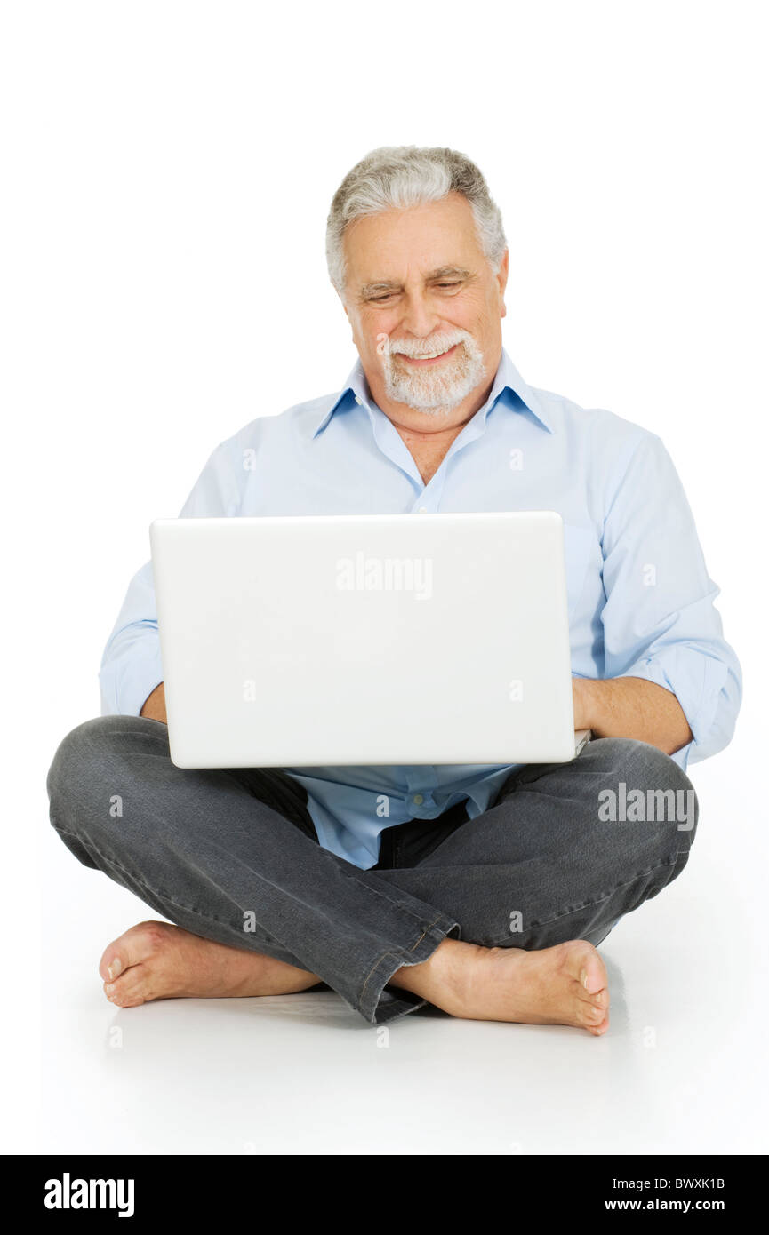 Smiling elderly man using Cut Out Stock Images & Pictures - Alamy