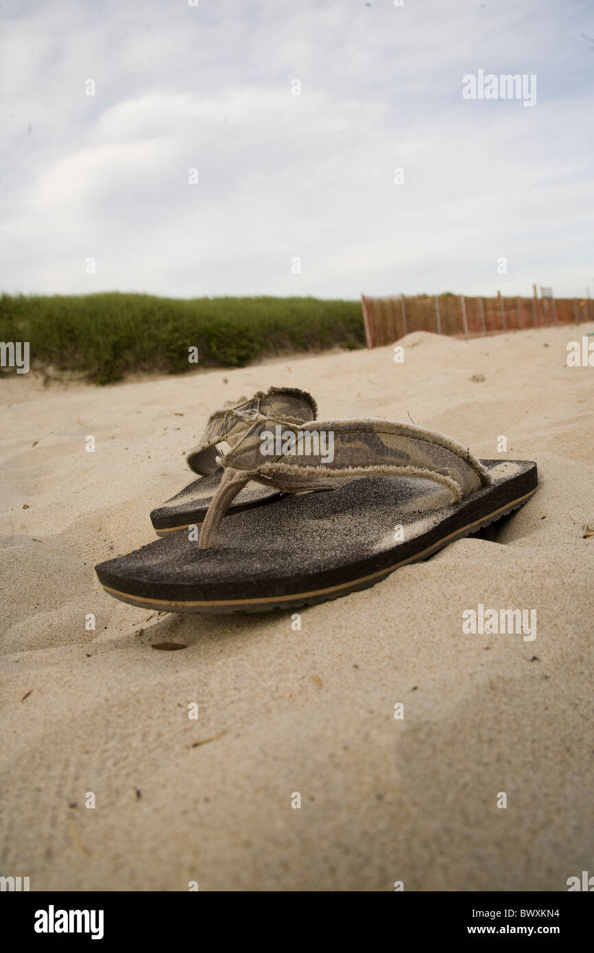 flip flops in sand on beach Stock Photo - Alamy