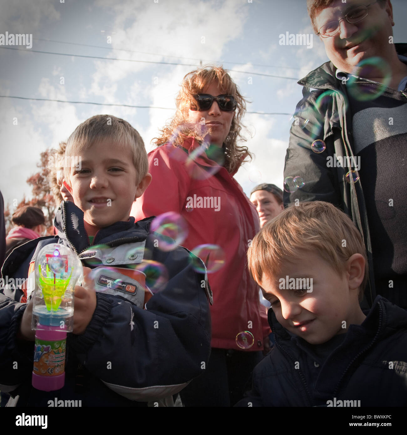 kids and family blow bubble at fair Stock Photo - Alamy