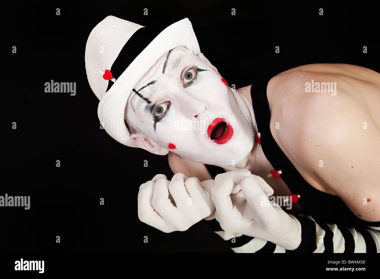portrait grimace mime in white hat isolated on black background Stock ...