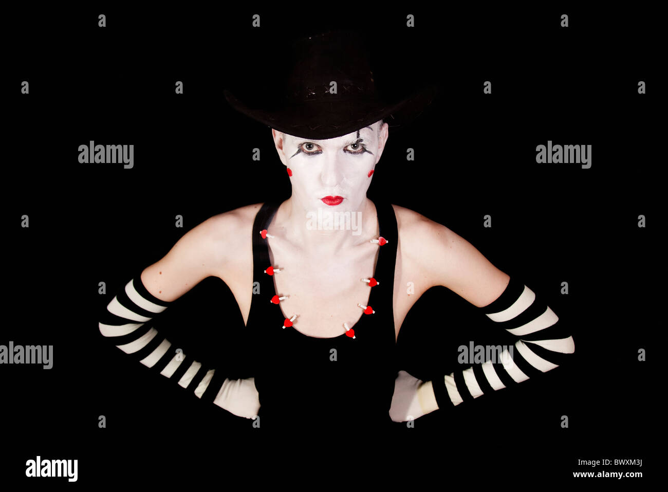 Portrait of pantomime actor with makeup on black background close up ...