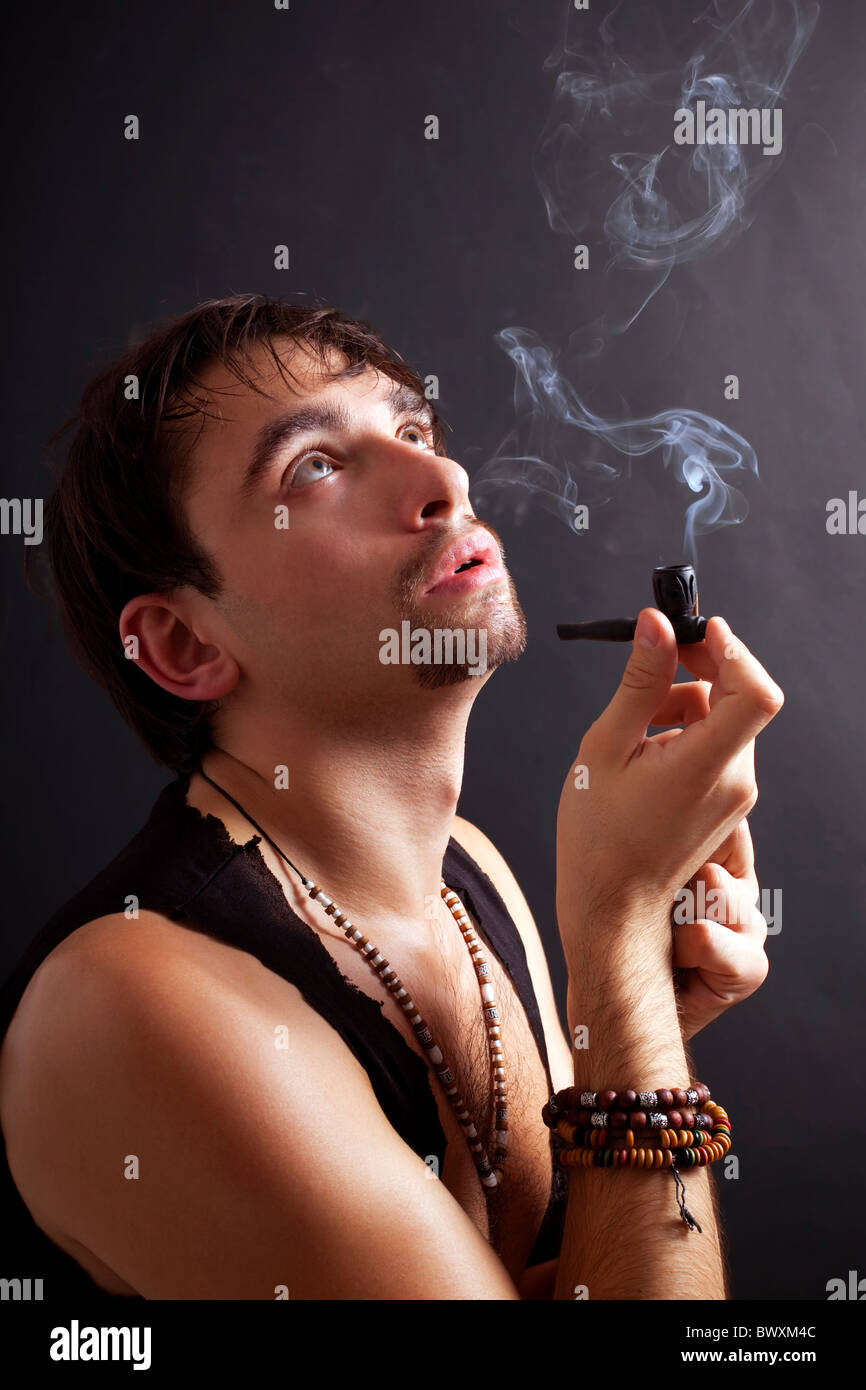 Young man smoking little hi-res stock photography and images - Alamy