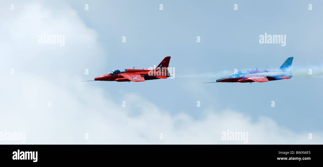 Two gnats ex red arrows trailing each other emitting smoke - rear one ...