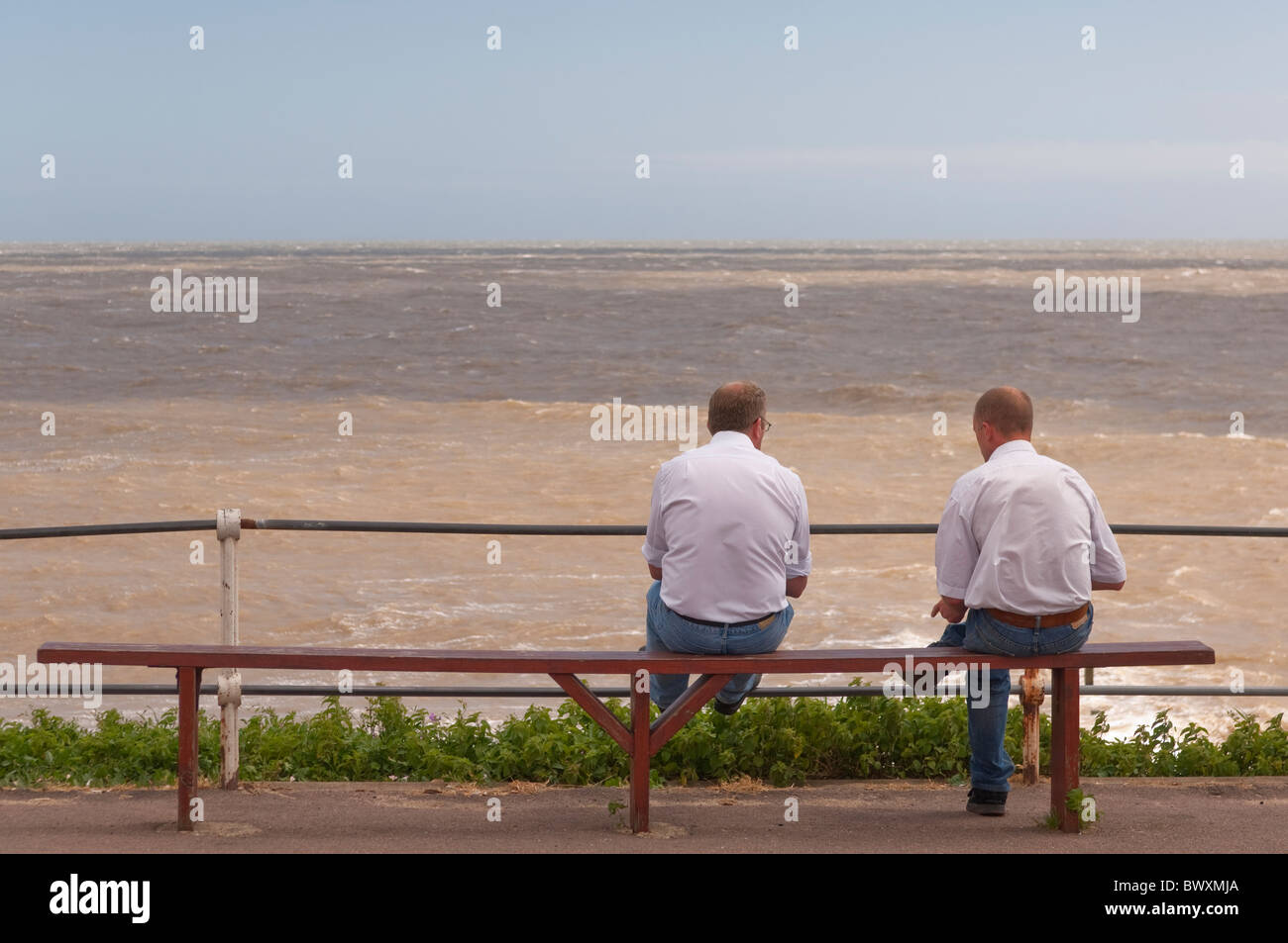 Two Men Man Sitting On A Bench High Resolution Stock Photography and ...