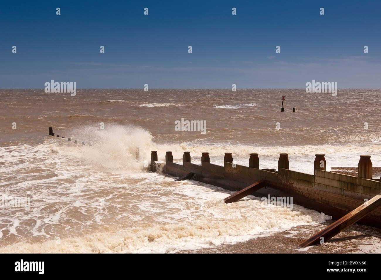 Wave waves breaking over the groin groins hi-res stock photography and ...
