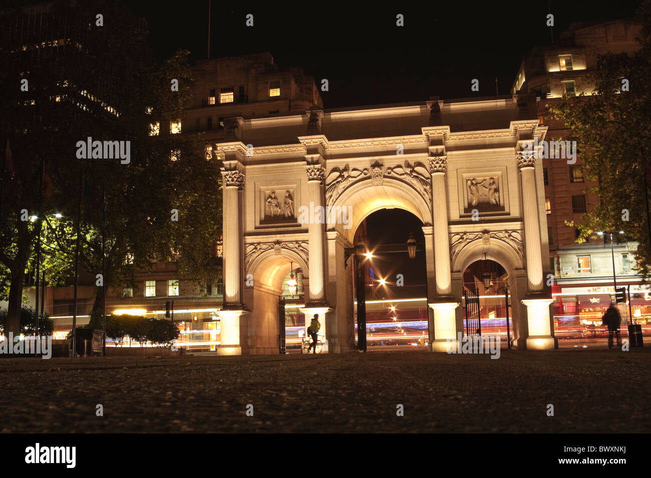 A landscape shot showing Marble Arch lit-up at night-time Stock Photo ...