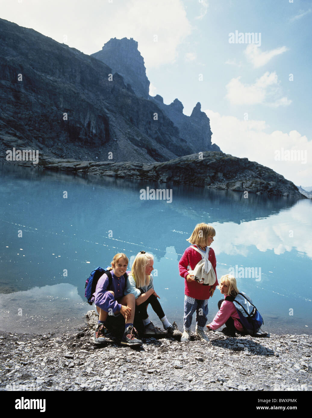 alpine Alps mountains group children Pizol Switzerland Europe lake sea ...