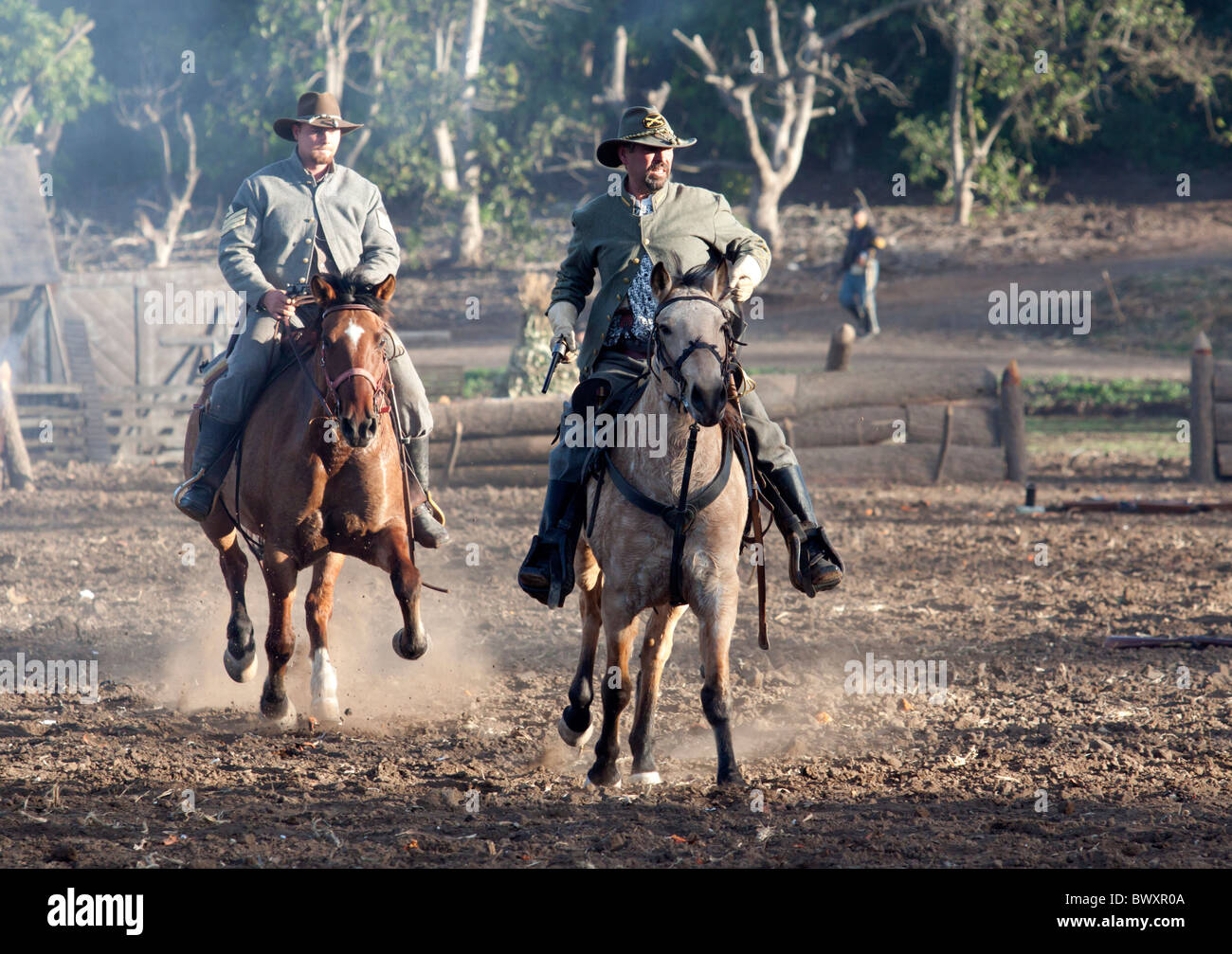 Two Confederate soldiers leading the charge on horseback during Civil ...