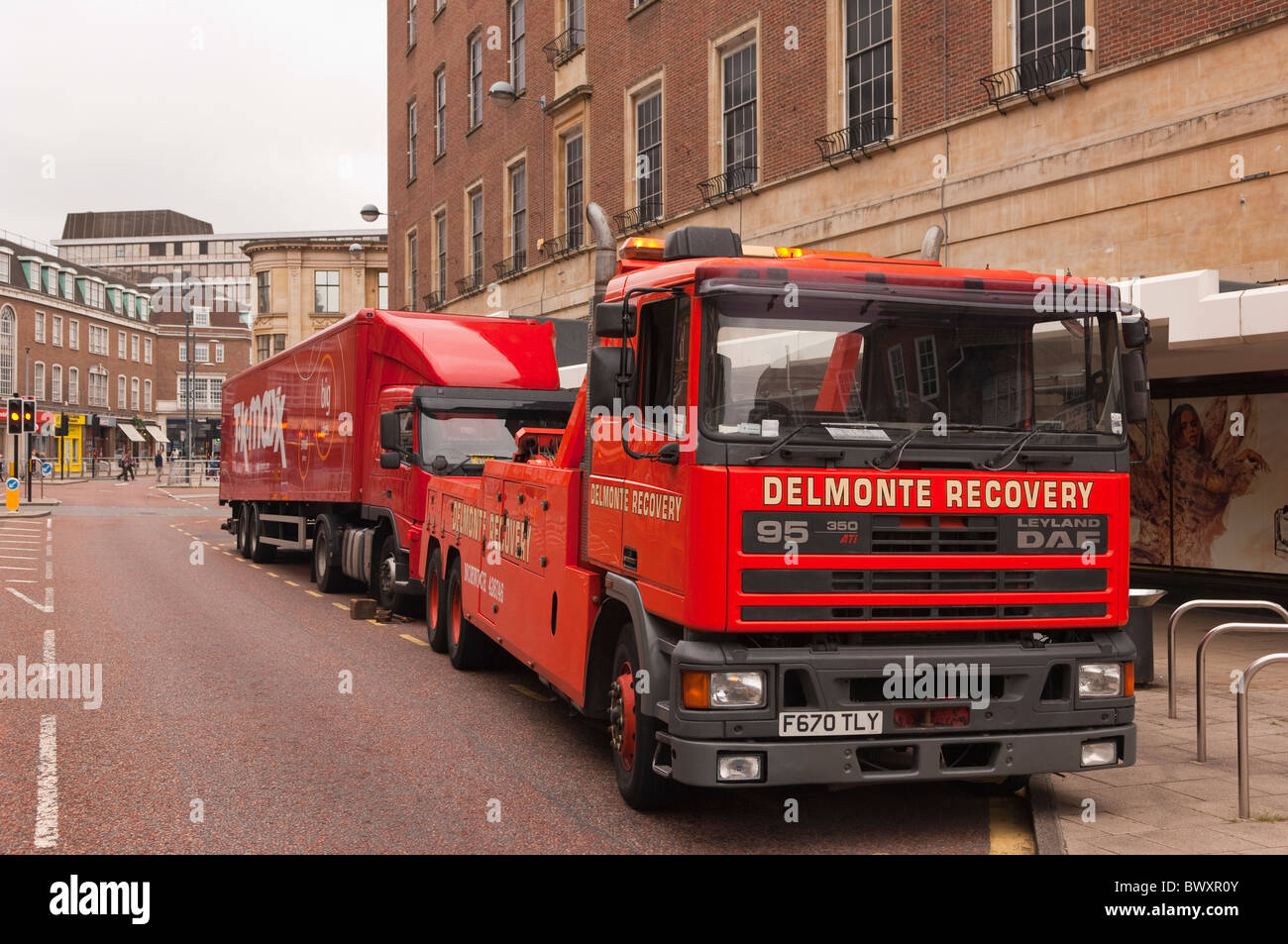 A broken down HGV lorry getting ready to be towed away by a recovery ...