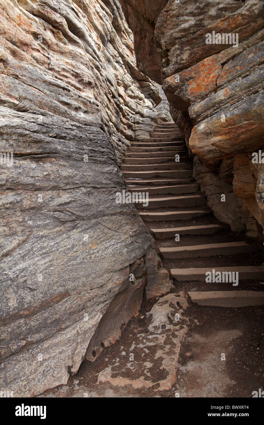 Stairs through gap eroded in limestone layers, Athabasca Falls, by ...