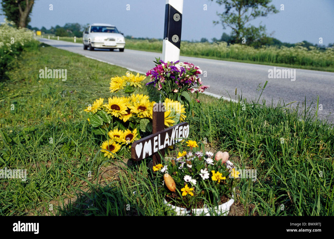 flowers commemorative site cross street edge traffic accident casualty ...