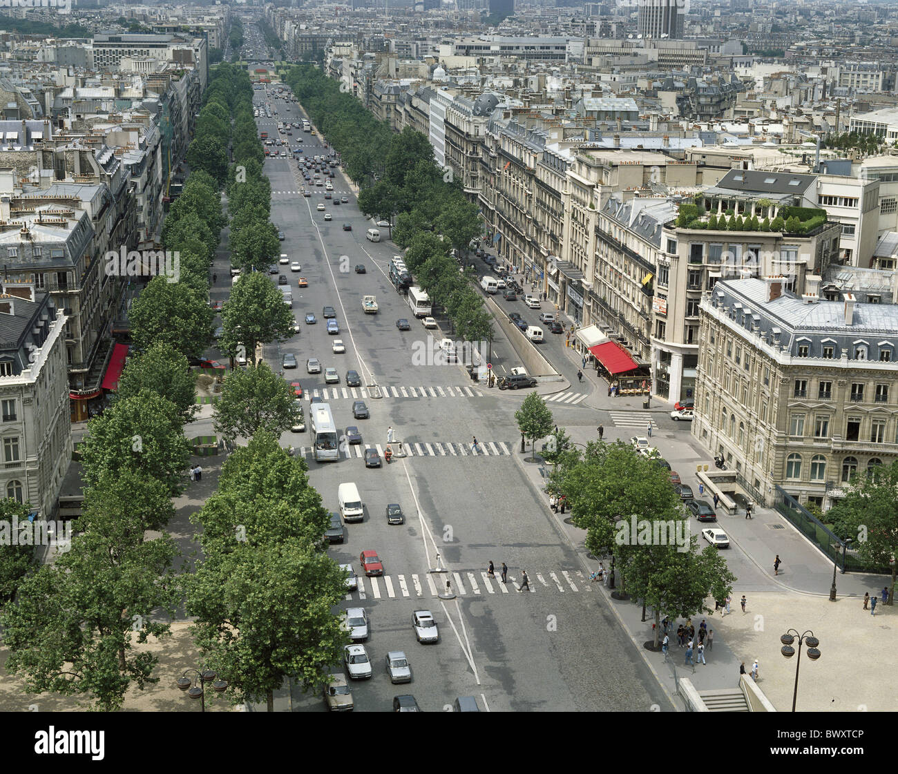 wide street France Europe Paris overview lined by trees Stock Photo - Alamy