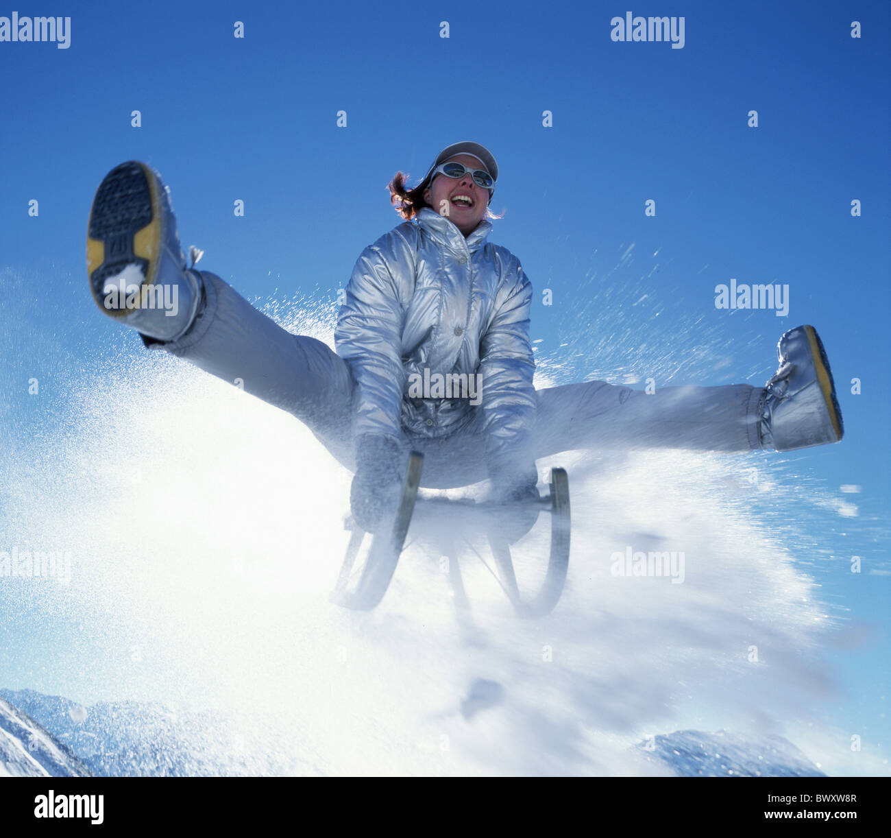 winter sports sport sledge sleigh overview woman Graubunden Grisons ...