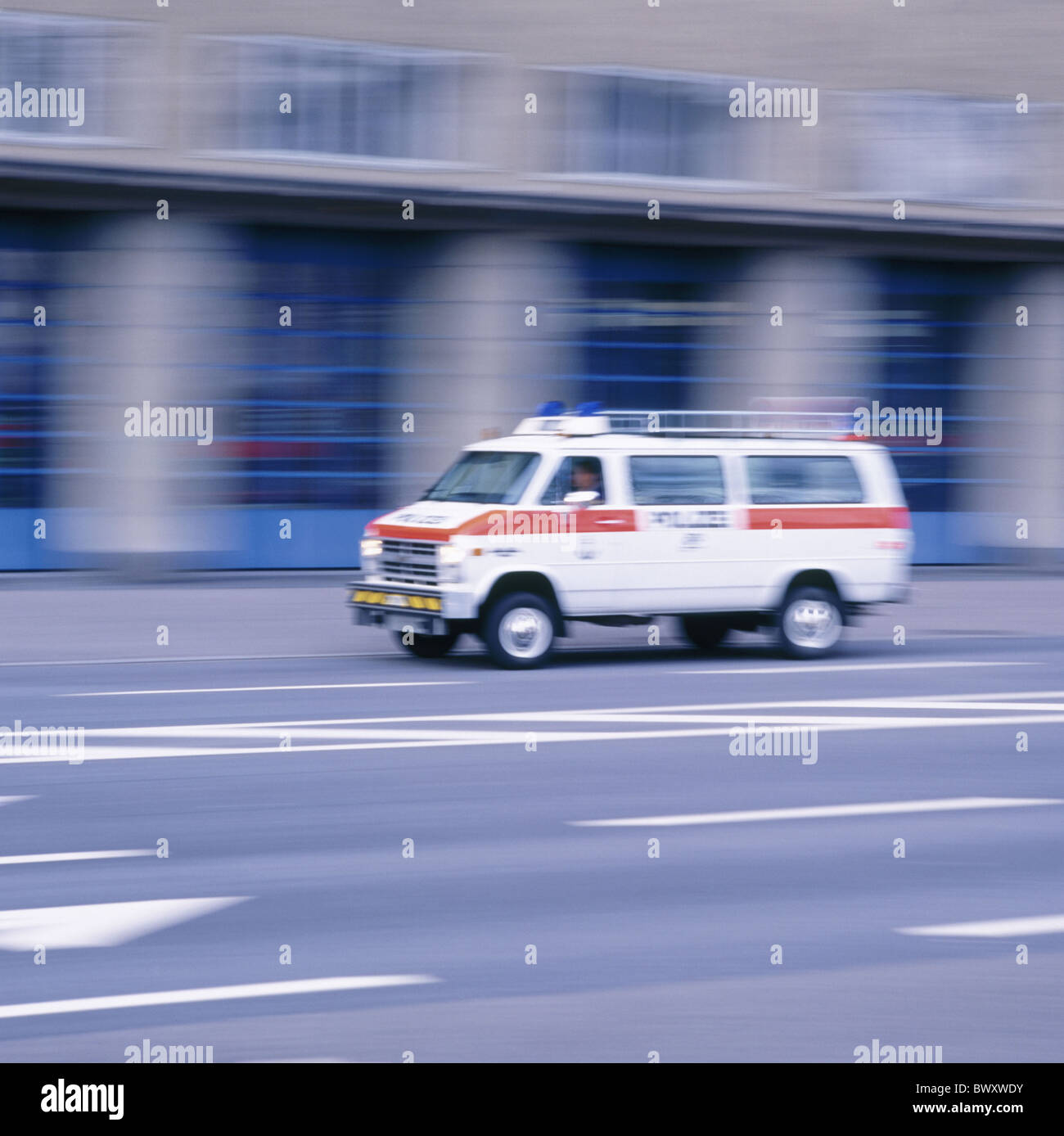 go police police car car automobile Switzerland Europe blurs town city ...