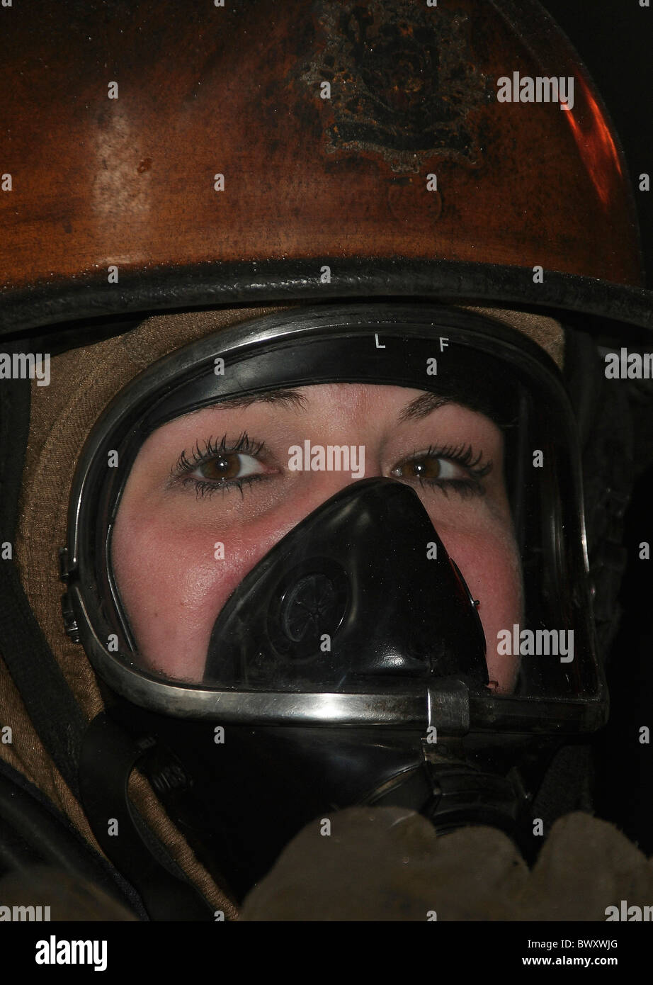 Female firefighter wearing BA gear Stock Photo - Alamy