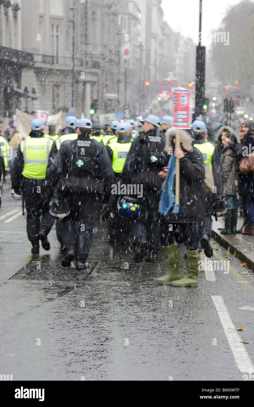 Police following student demonstrators through snowy London streets ...