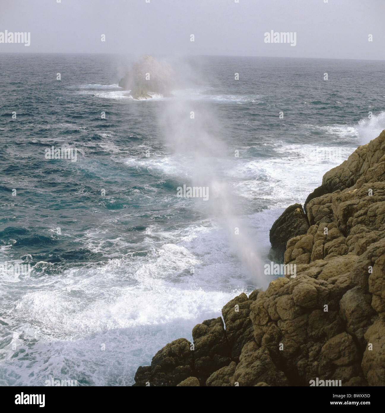 surf waves Majorca coast water splash sea cliff Stock Photo - Alamy