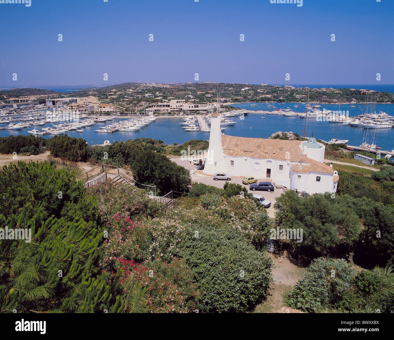 Italy Europe Sardinia Costa Smeralda Porto Cervo church yacht harbour ...