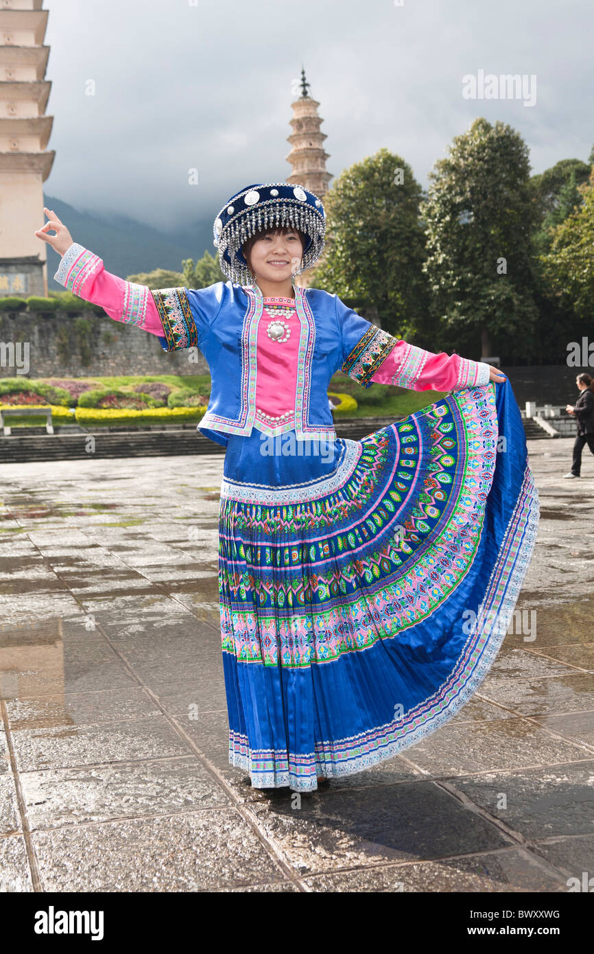 Woman wearing a traditional colourful dress, Dali, Yunnan Province ...