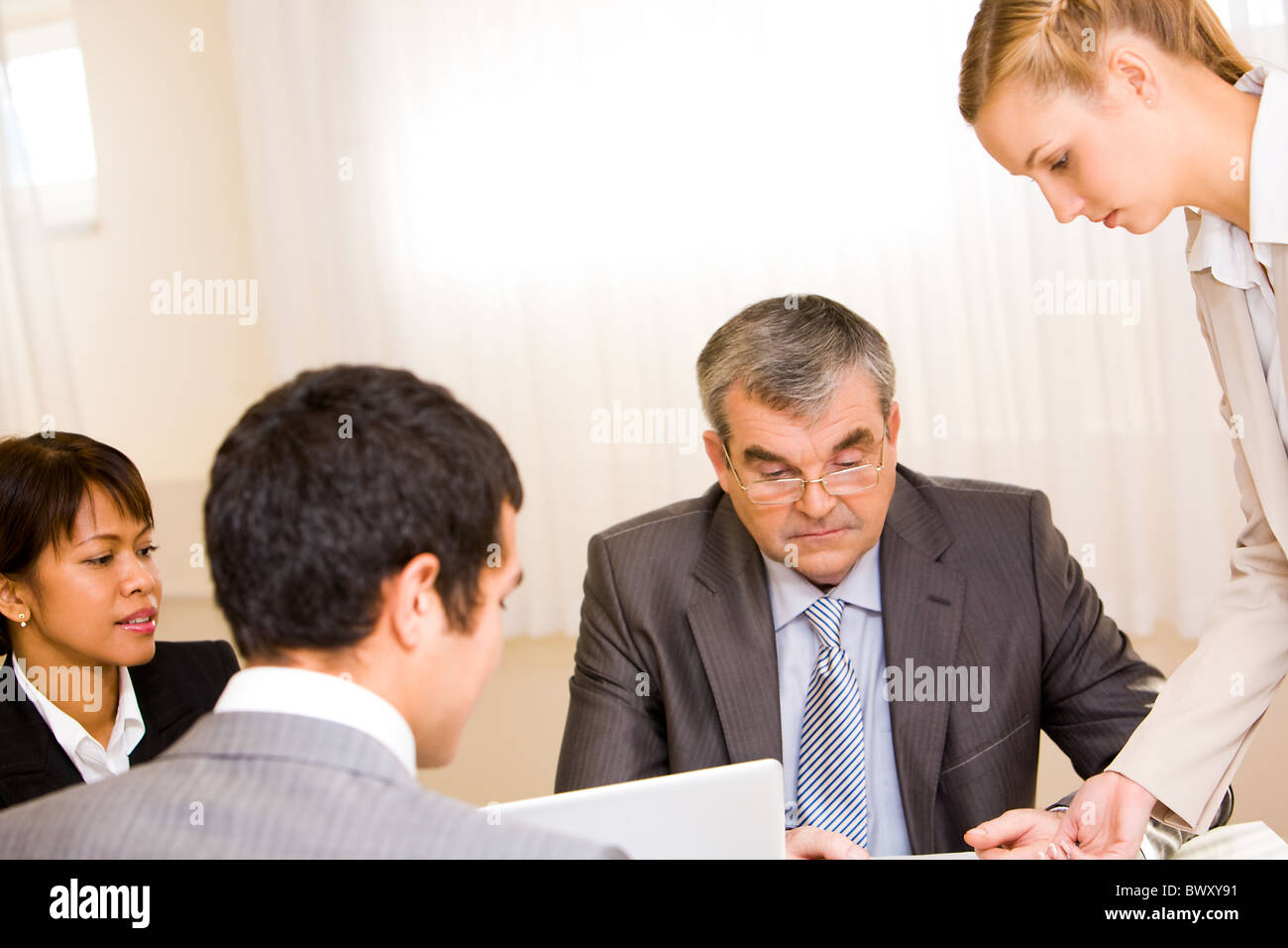Image of business people communicating at meeting in the office Stock ...