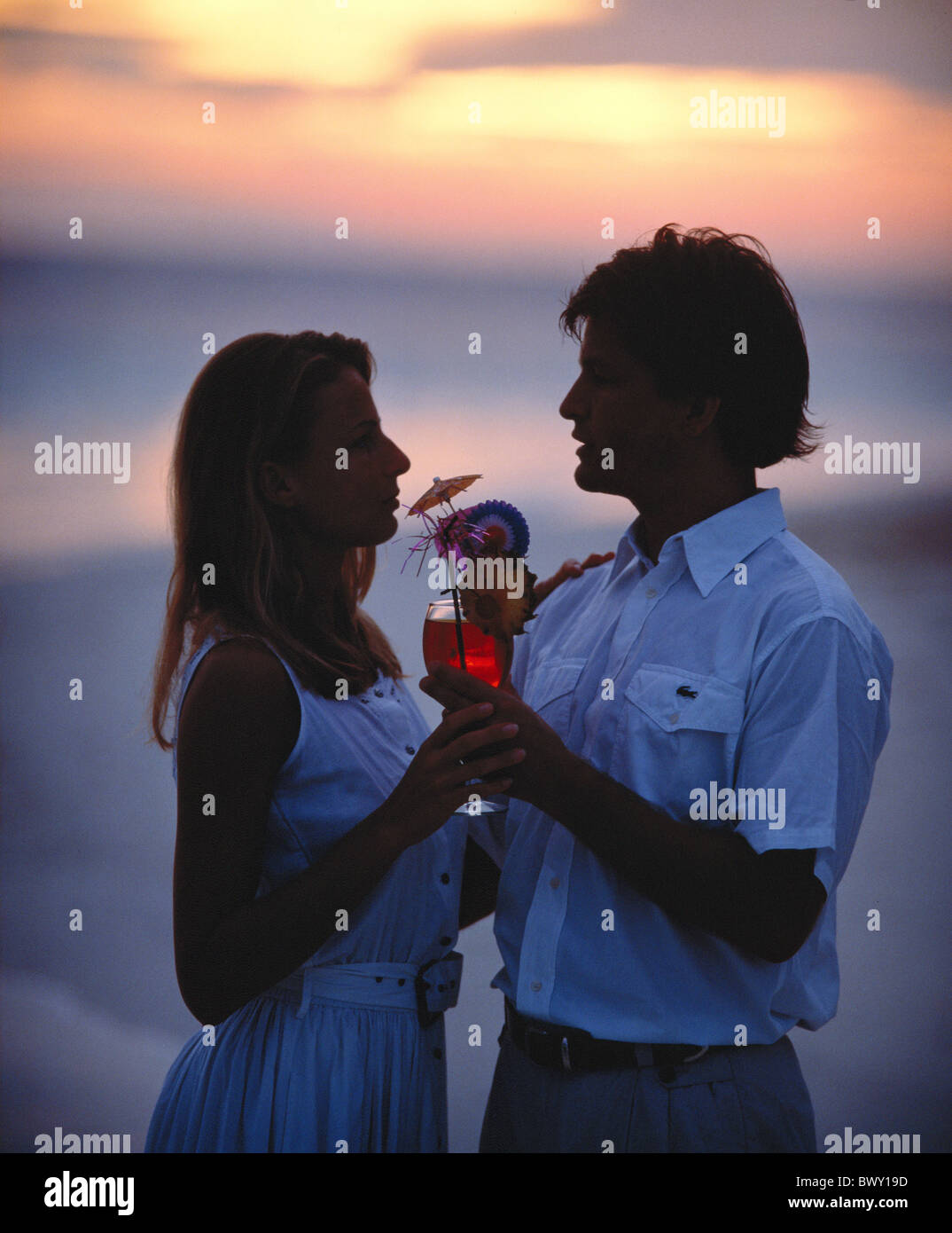 drinks Food pair couple romantical sundown beach seashore embrace ...