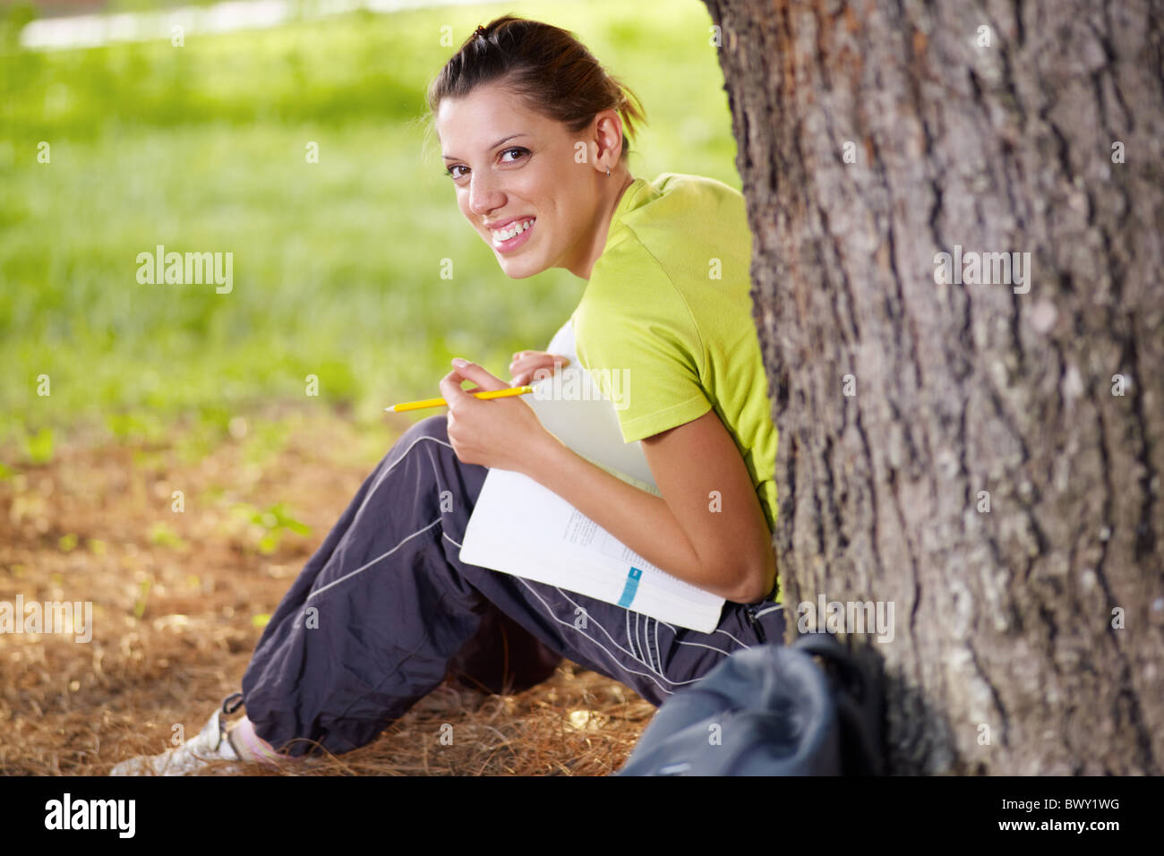 college student looking back and smiling. Copy space Stock Photo - Alamy